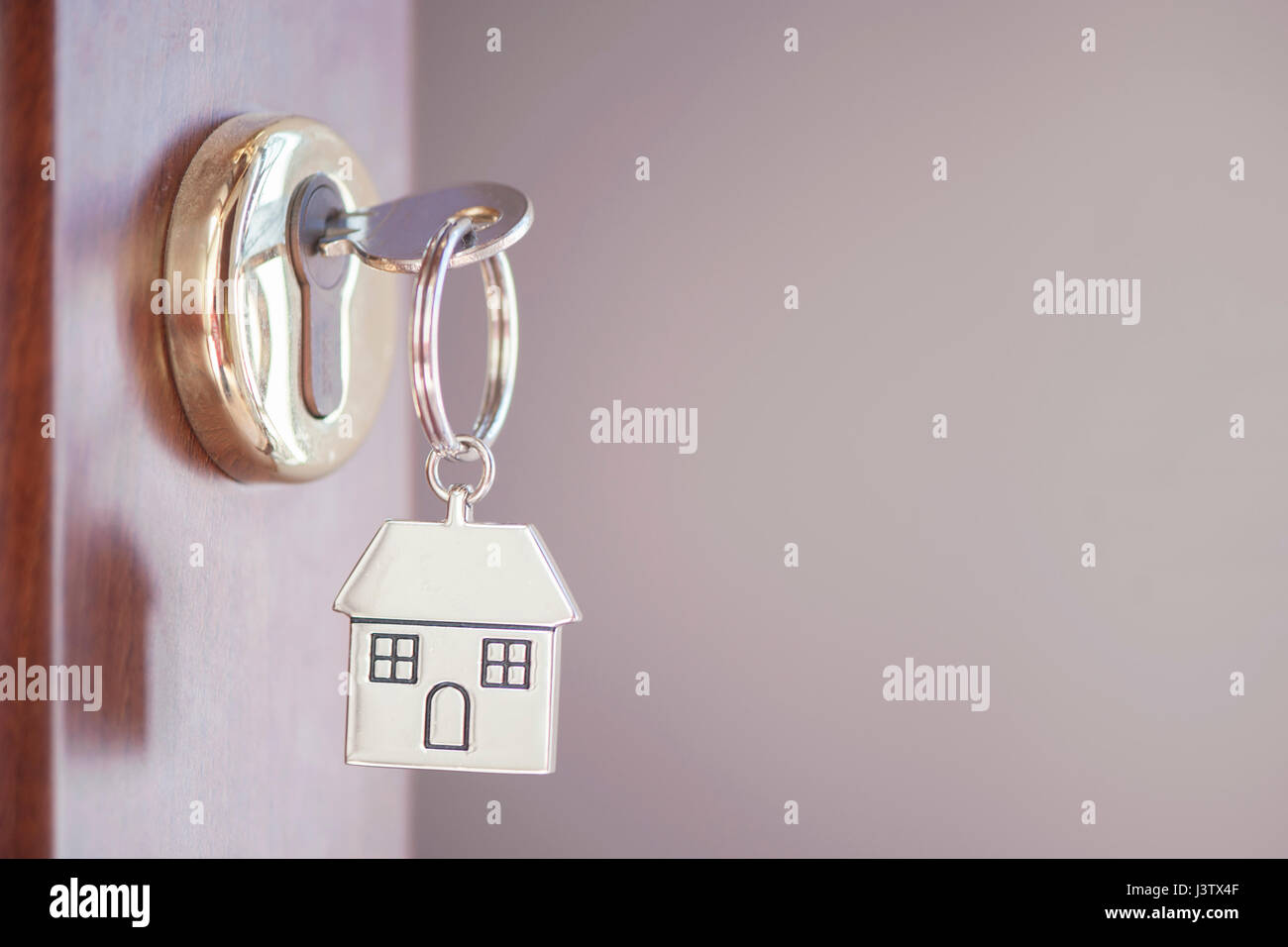 House key in the door Stock Photo - Alamy