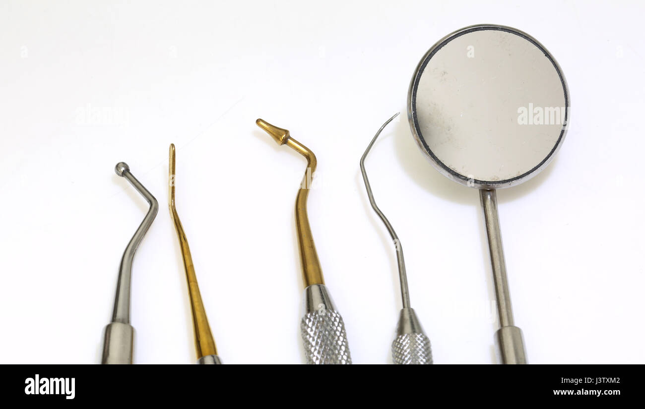 five dental tools for cleaning the teeth and checking the caries on ...