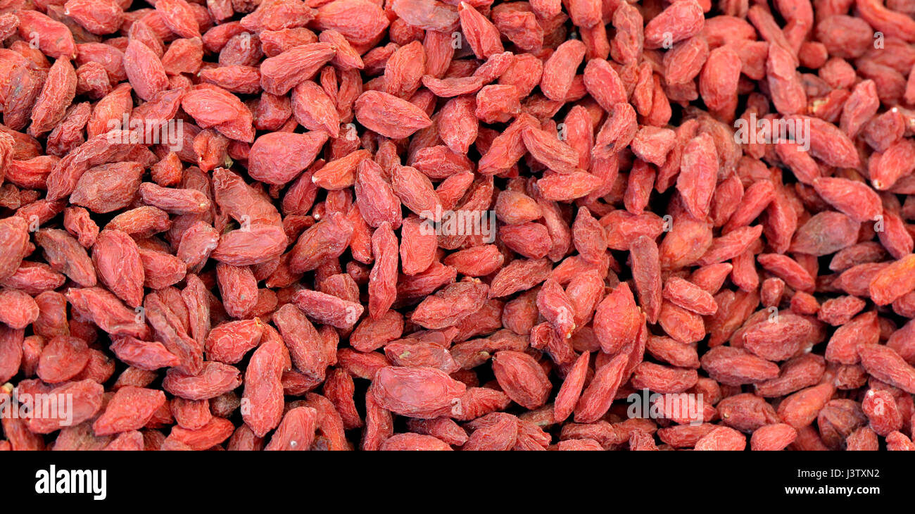background of Red dried goji berries also called wolfberry with many ...