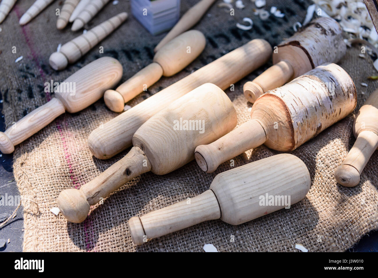 Collection of turned wooden mallets in various stages of manufacture ...