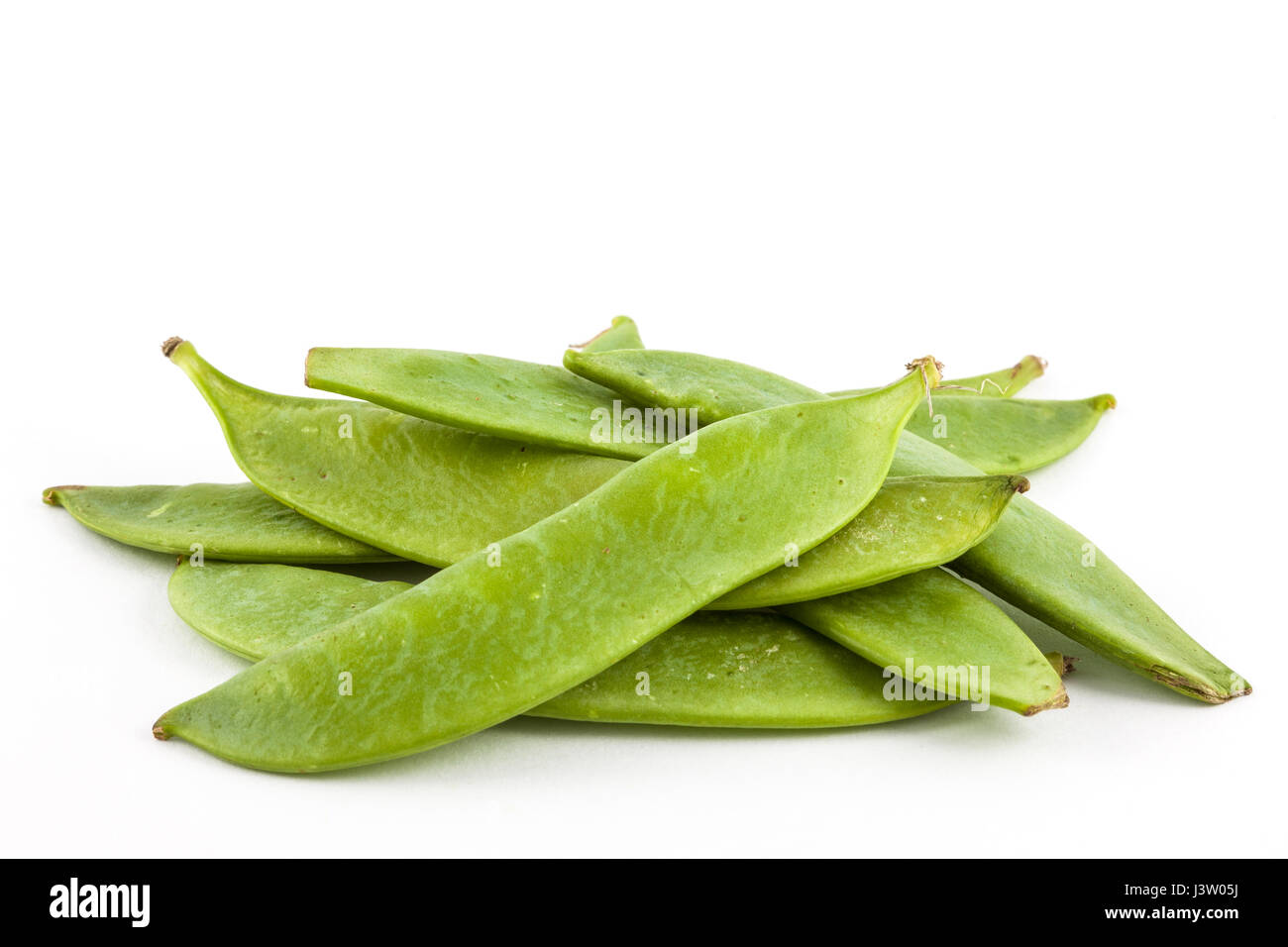 Green peas (Pisum sativum) isolated in white background Stock Photo - Alamy