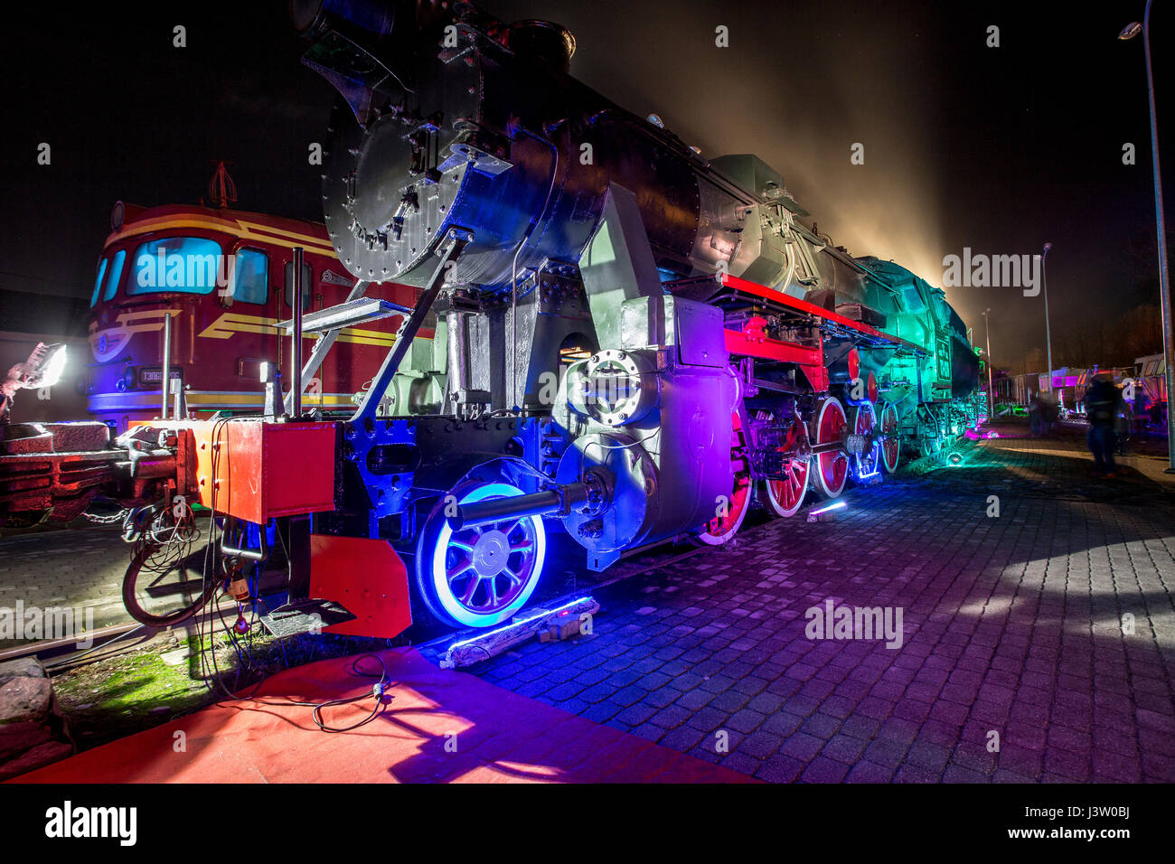 Soviet locomotive train colored at night Stock Photo - Alamy