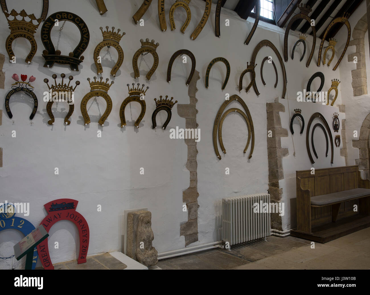 Horseshoes on the interior walls of Oakham Castle in Rutland which is ...