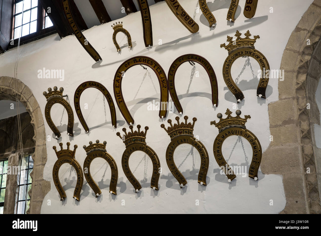 Horseshoes on the interior walls of Oakham Castle in Rutland which is ...