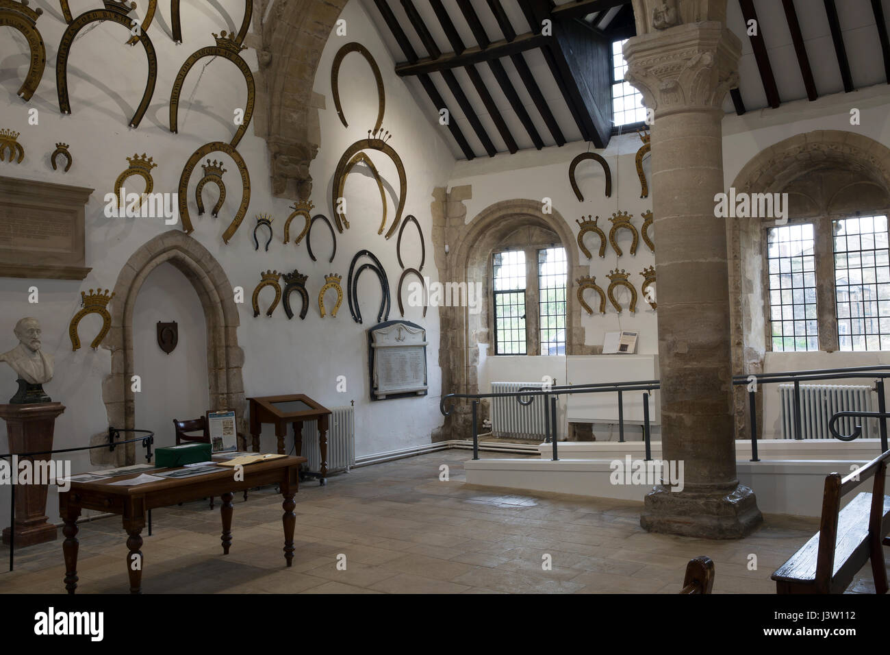 Horseshoes on the interior walls of Oakham Castle in Rutland which is ...