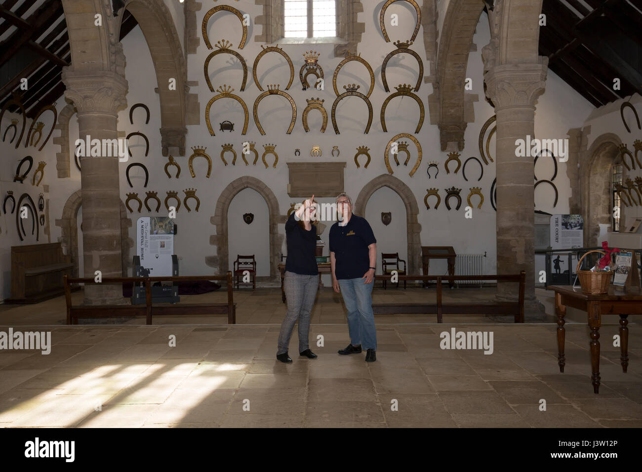 Horseshoes on the interior walls of Oakham Castle in Rutland which is ...