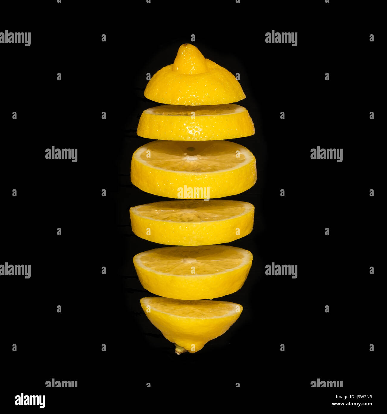 Flying lemon. Sliced lemon isolated on black background. Levity fruit ...