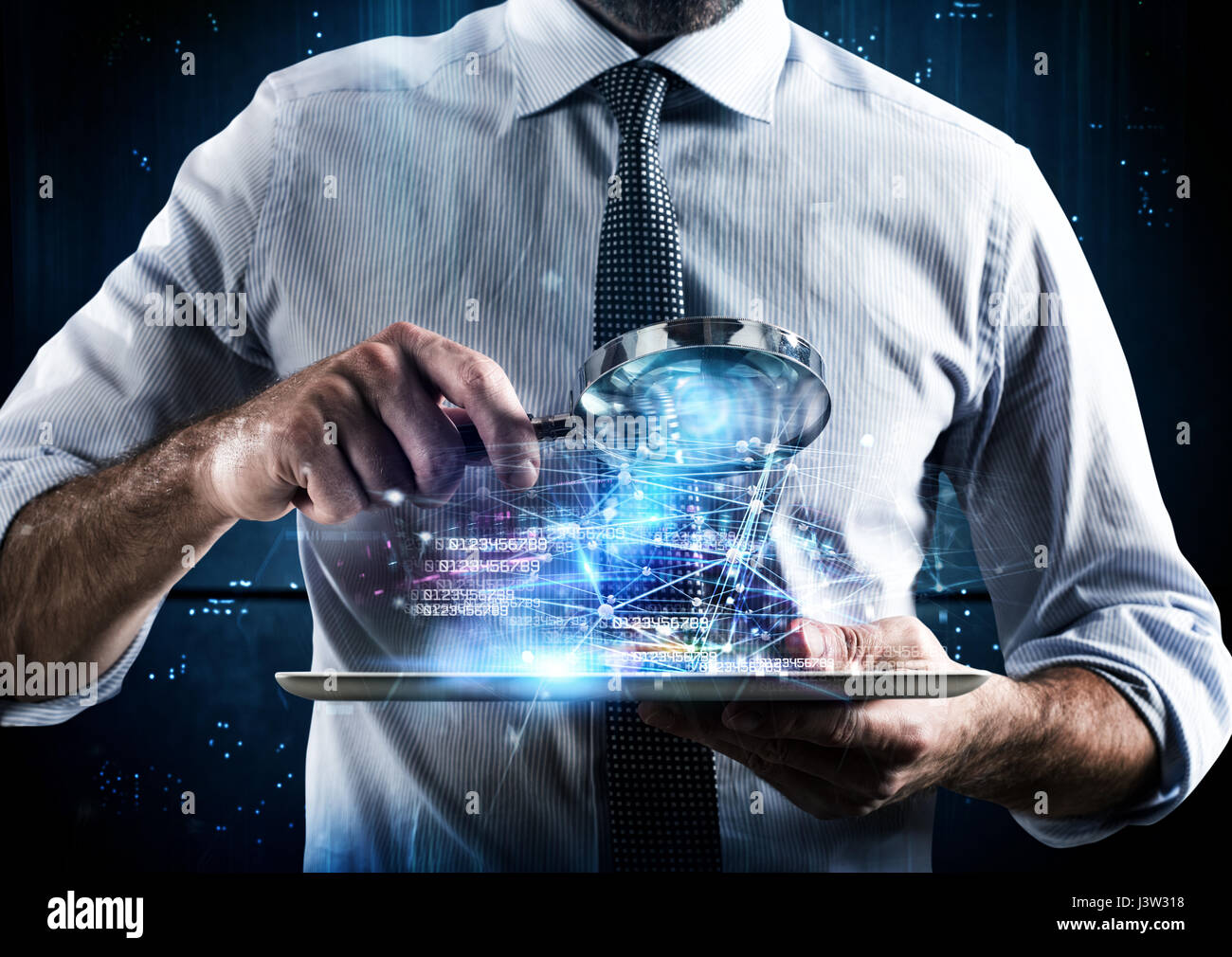 Examine a computer tablet Stock Photo - Alamy