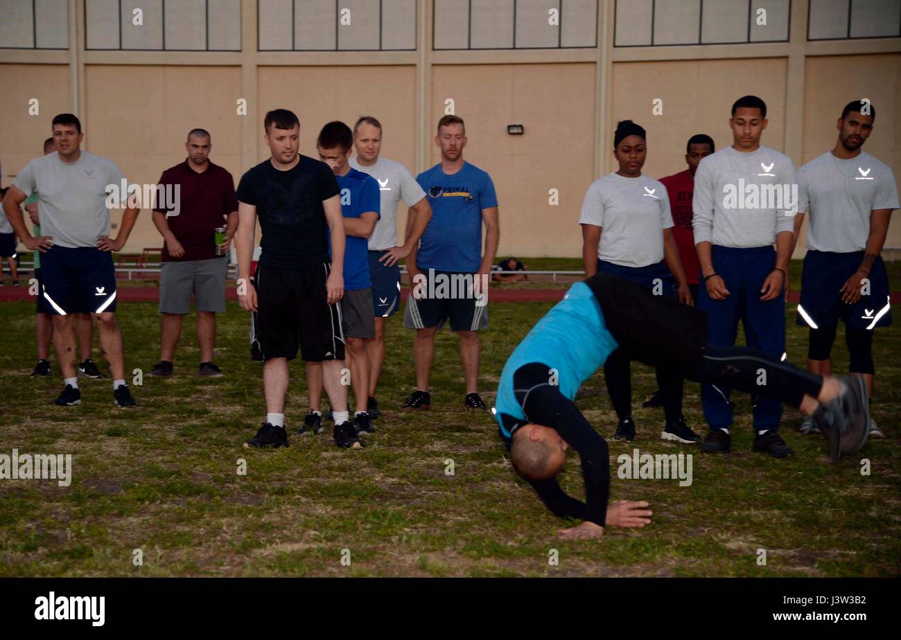 An Alpha Warrior athlete demonstrates a physical obstacle maneuver ...