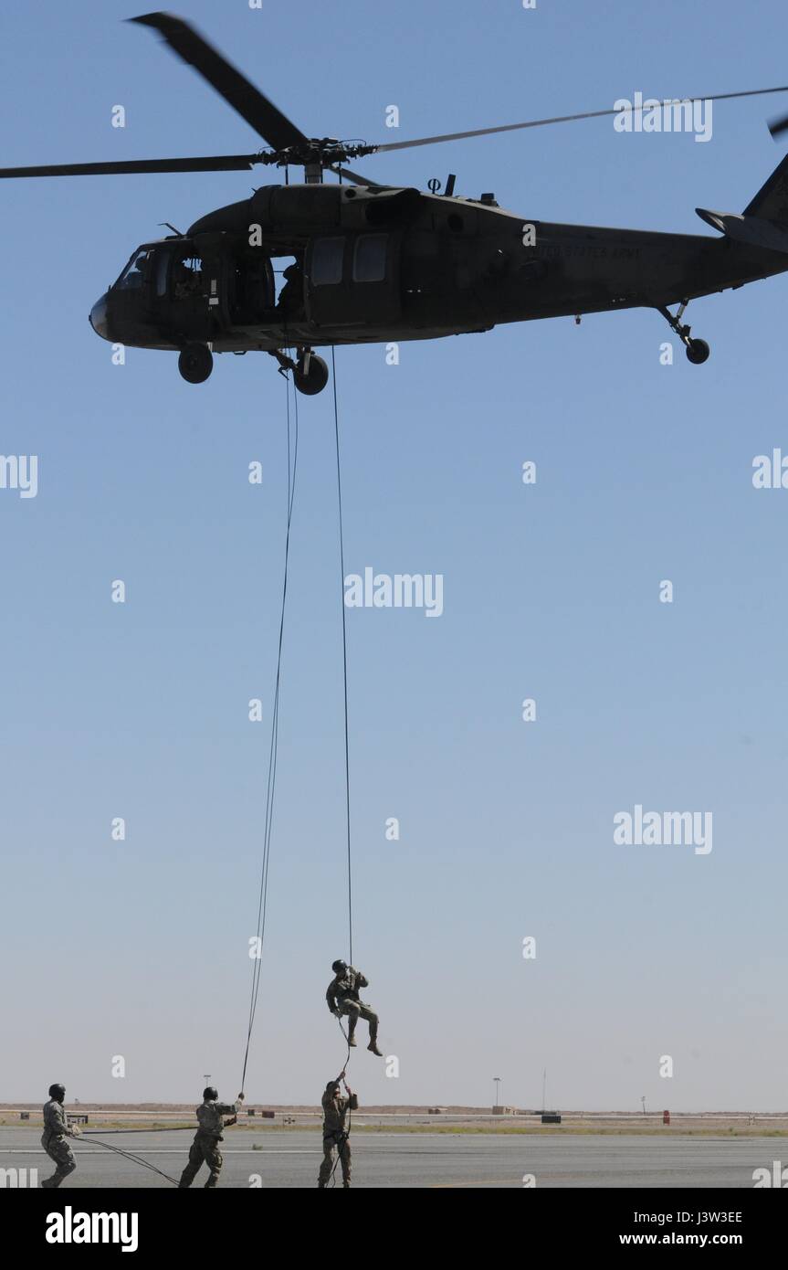 U.S. Army Soldiers rappel out of a UH-60 helicopter on April 20 at Camp ...