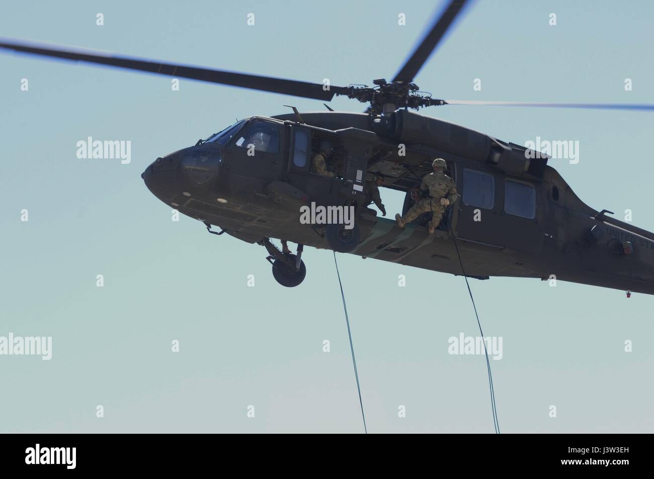 U.S. Army Soldiers prepare to rappel from a UH-60 Blackhawk helicopter ...