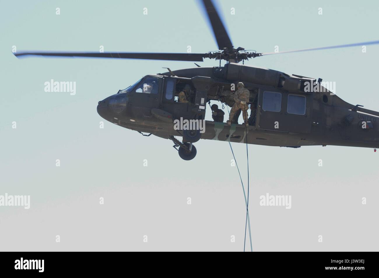 U.S. Army Soldiers prepare to rappel out of a UH-60 helicopter on April ...