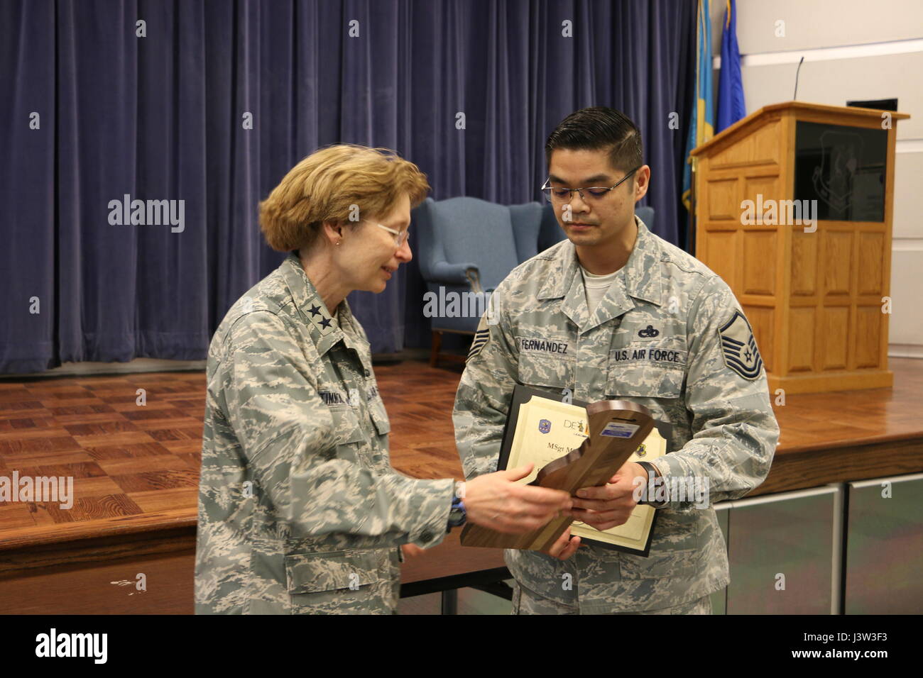 Maj. Gen. Carol Timmons presents Master Sgt. Michael Fernandez with the ...