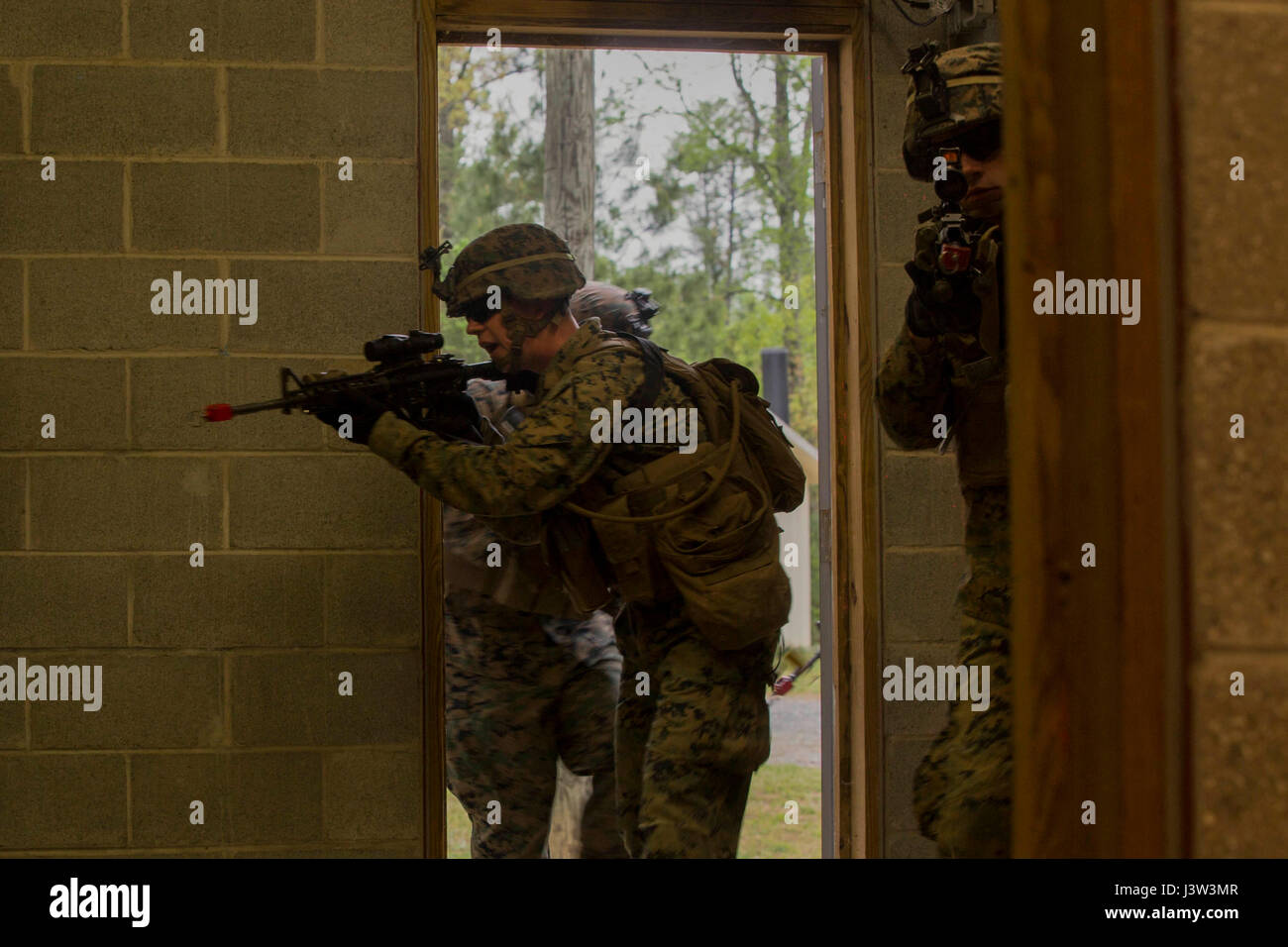 Marines clear a room during a military operations on urbanized terrain ...