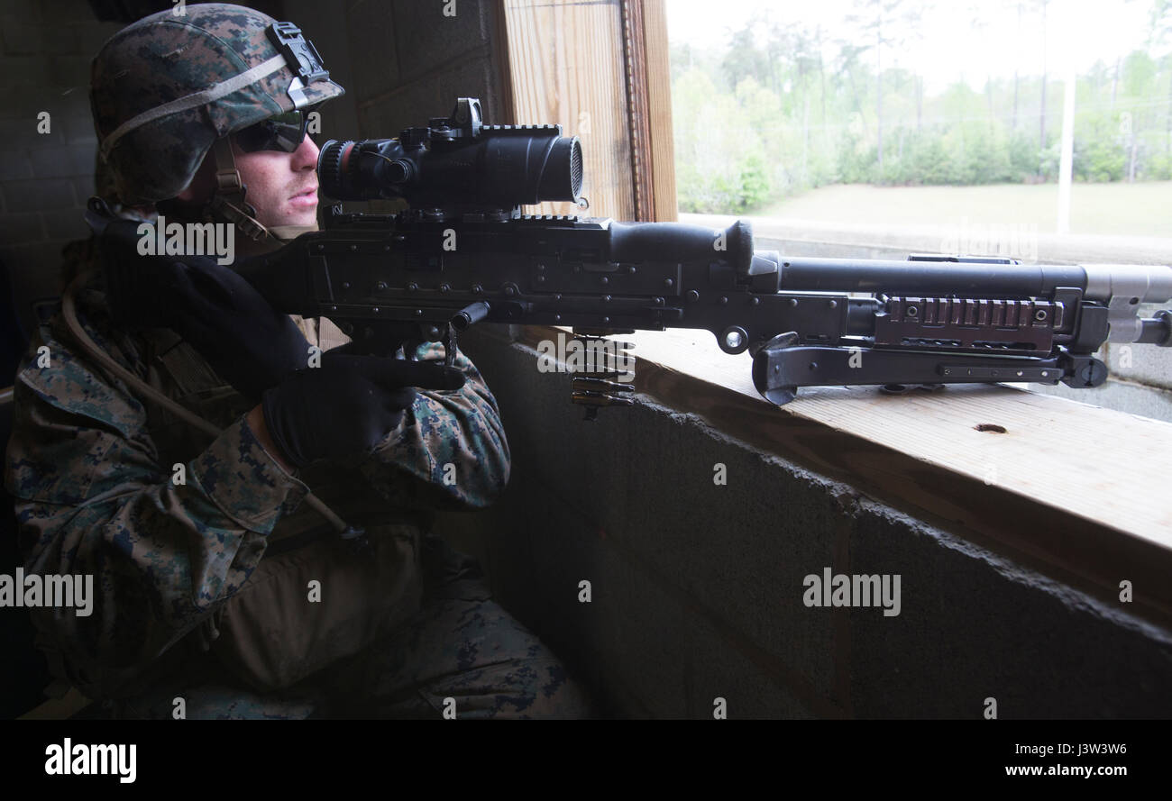 A Marine scans his sector of fire during a military operation on ...