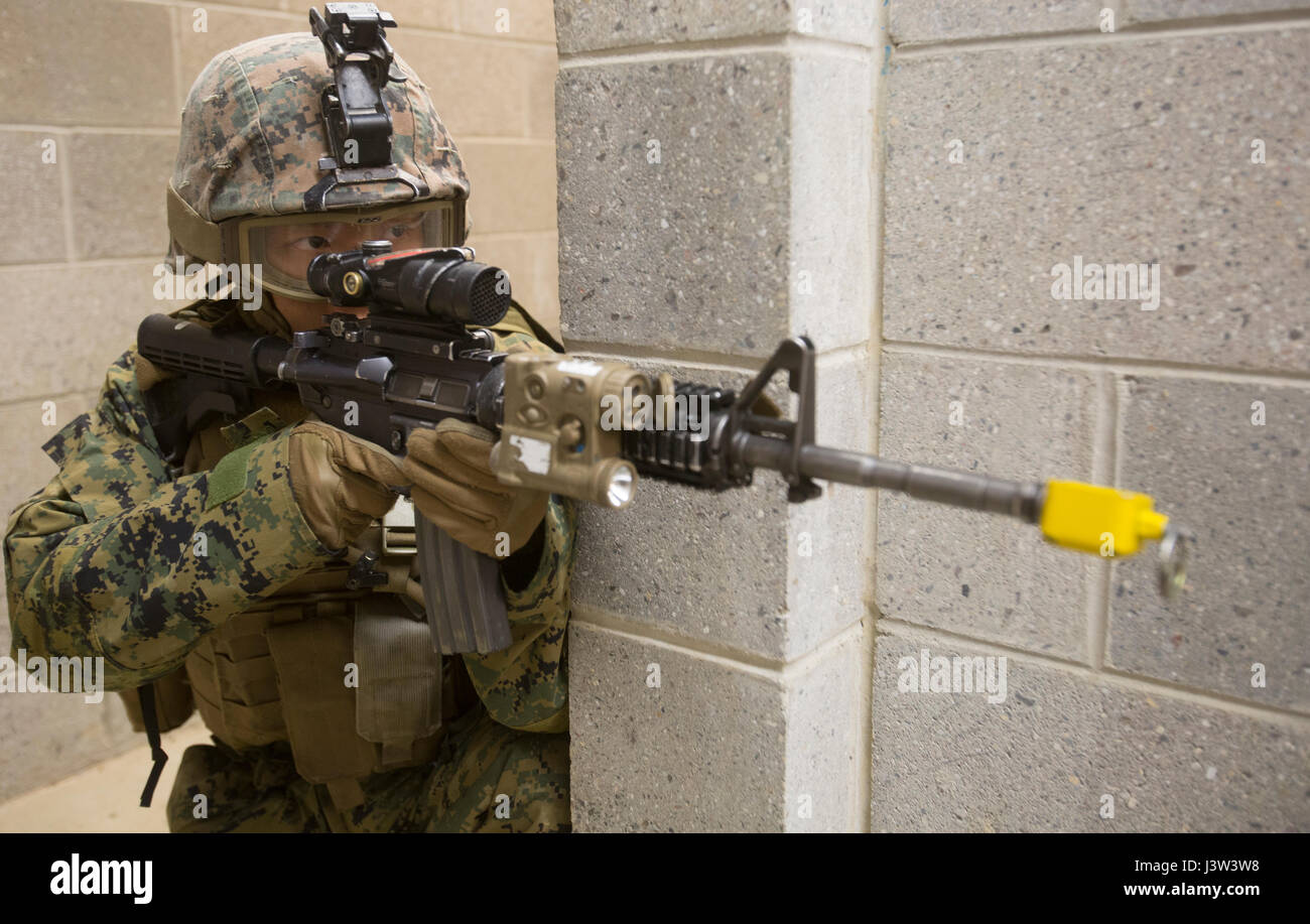 A Marine provides security during a military operation on urbanized ...
