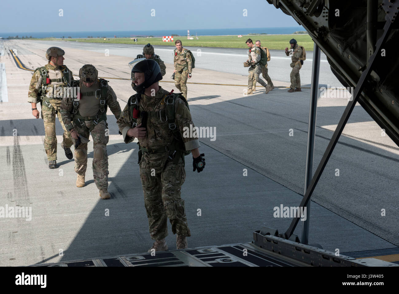 Airmen and Army soldiers conduct joint jump training aboard an MC-130J ...
