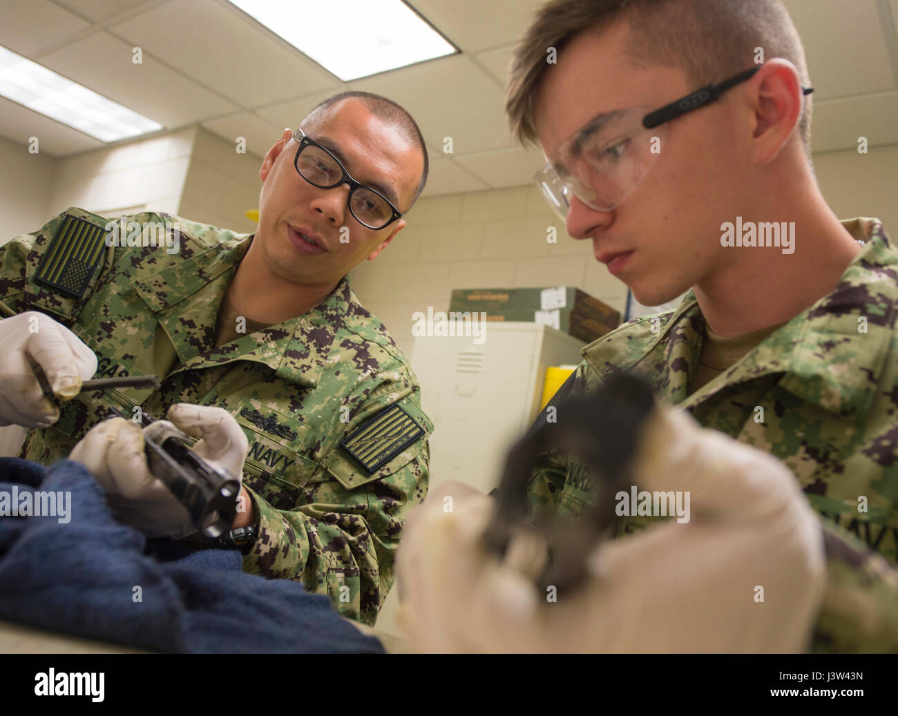 Navy personnel assigned to Navy Munitions Command Detachment Bahrain ...