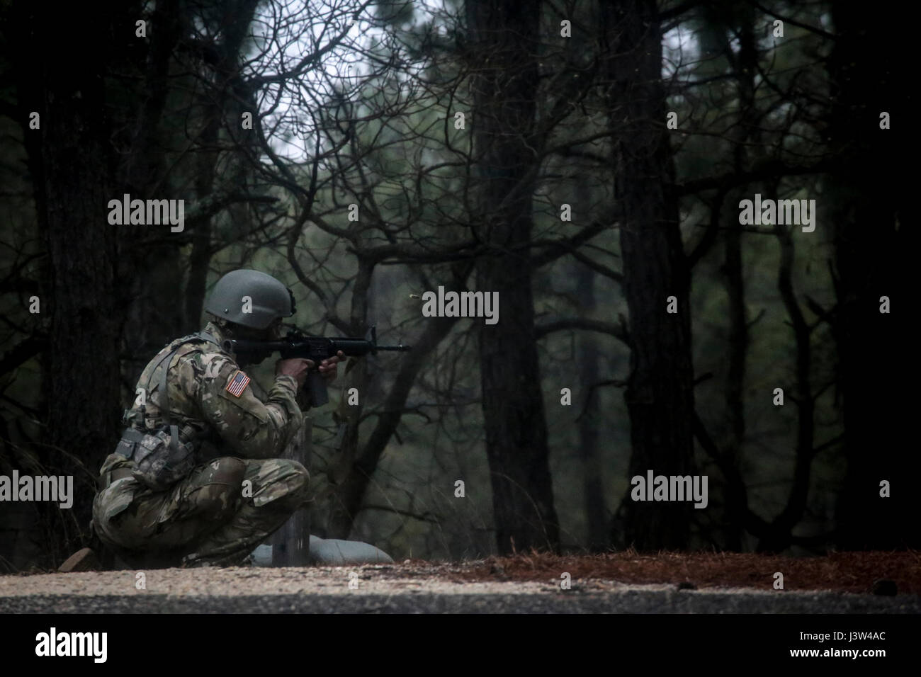 U.S. Army Sgt. Daniel Beachum takes aim at targets during the M4 rifle ...