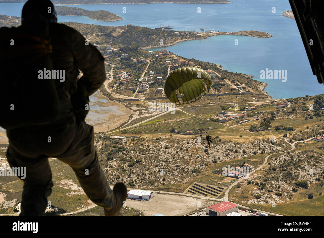 A Greek paratrooper conducts a military free-fall jump from a U.S. Air ...