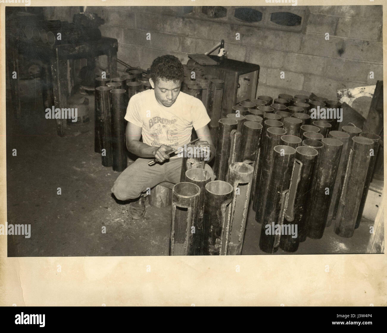 man working on something Stock Photo - Alamy
