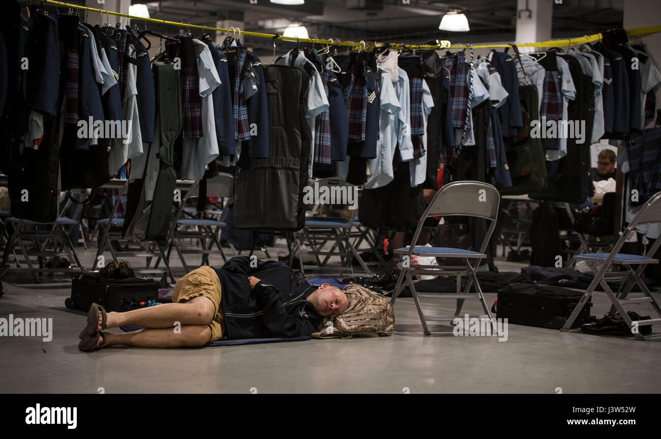 A performer in the Virginia International Tattoo takes a nap before the ...