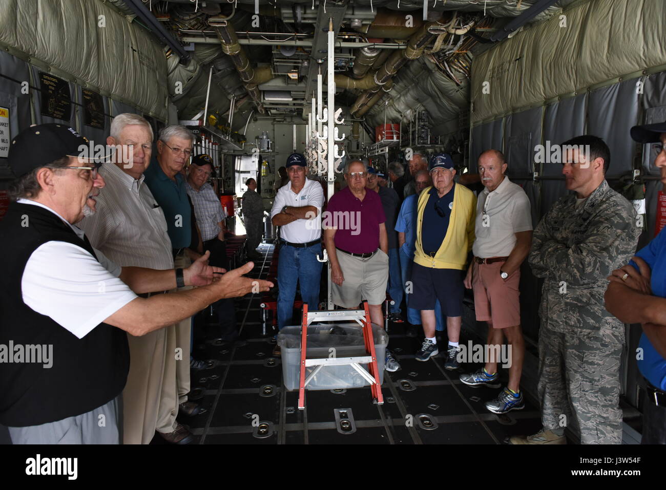 Col. Michael T. Gerock, 145th Airlift Wing Commander, right, listens to ...
