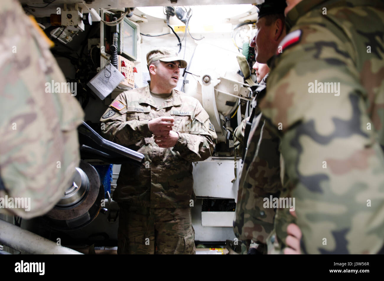 U.S. Soldiers brief Polish Soldiers on the capabilities of the M109A6 ...
