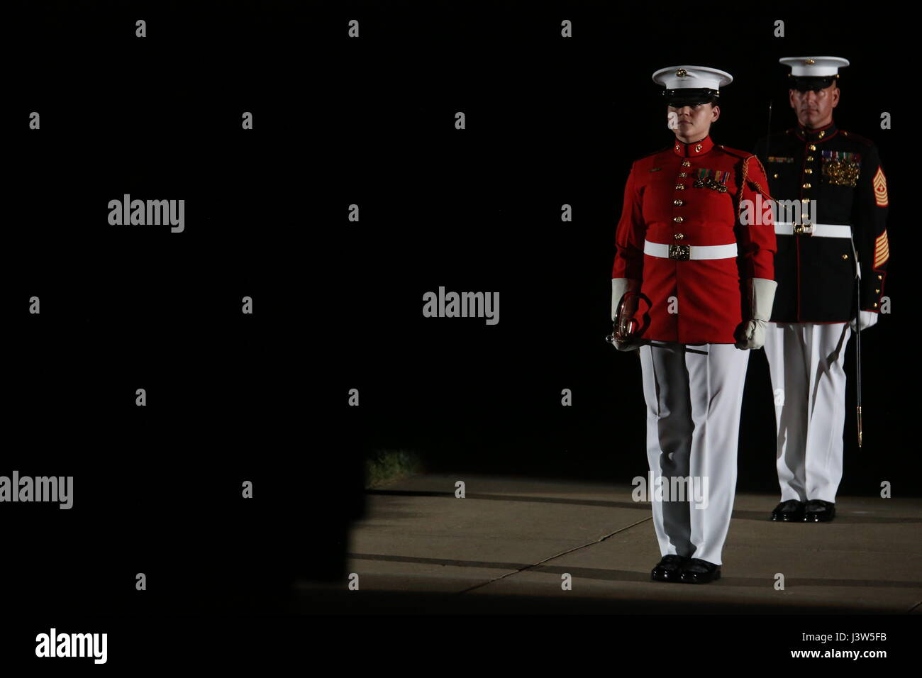 A ceremonial bugler assumes the position of attention after sounding ...