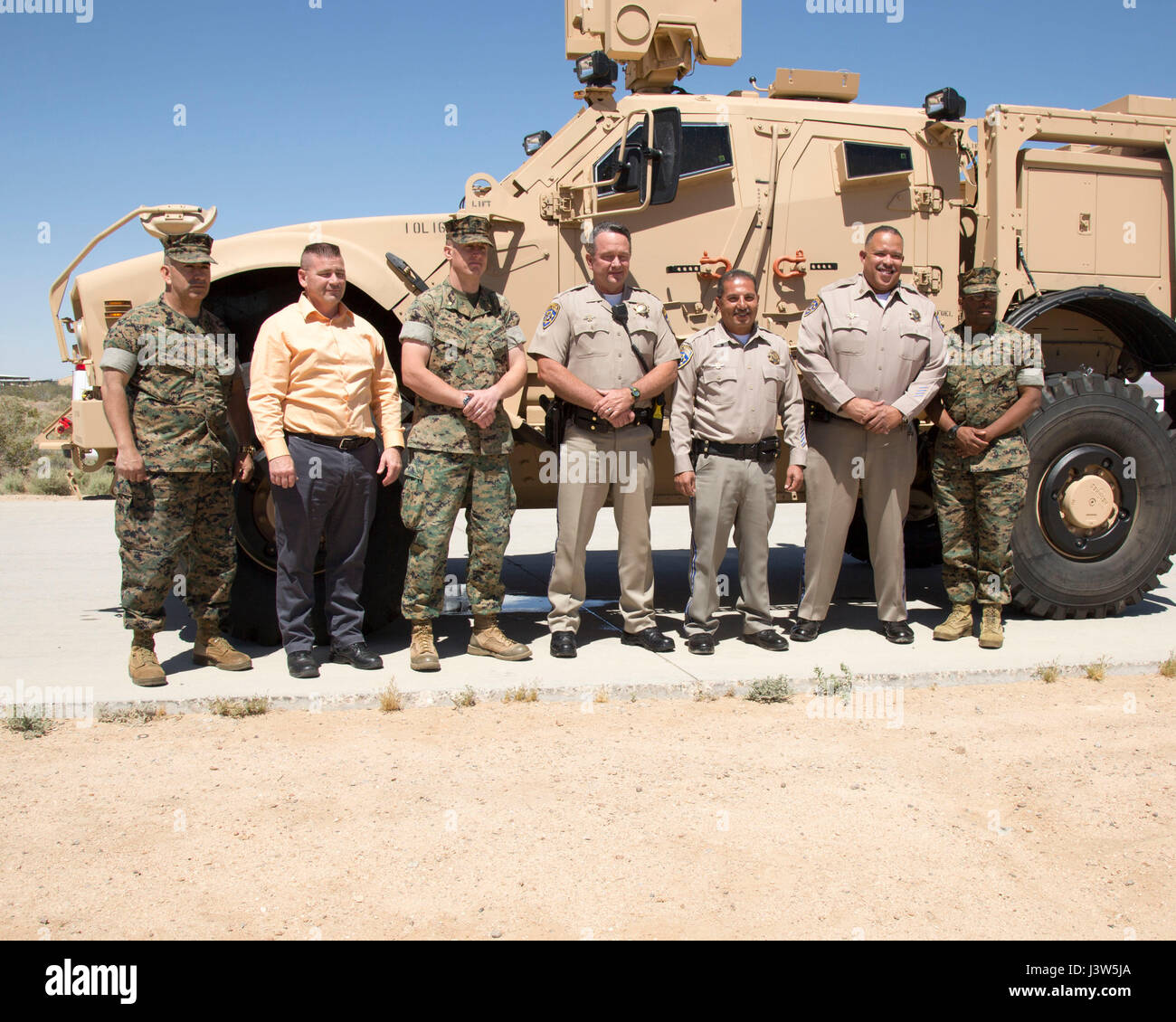 (Left) Standing in front of the Mine Resistant Ambush Protected All ...