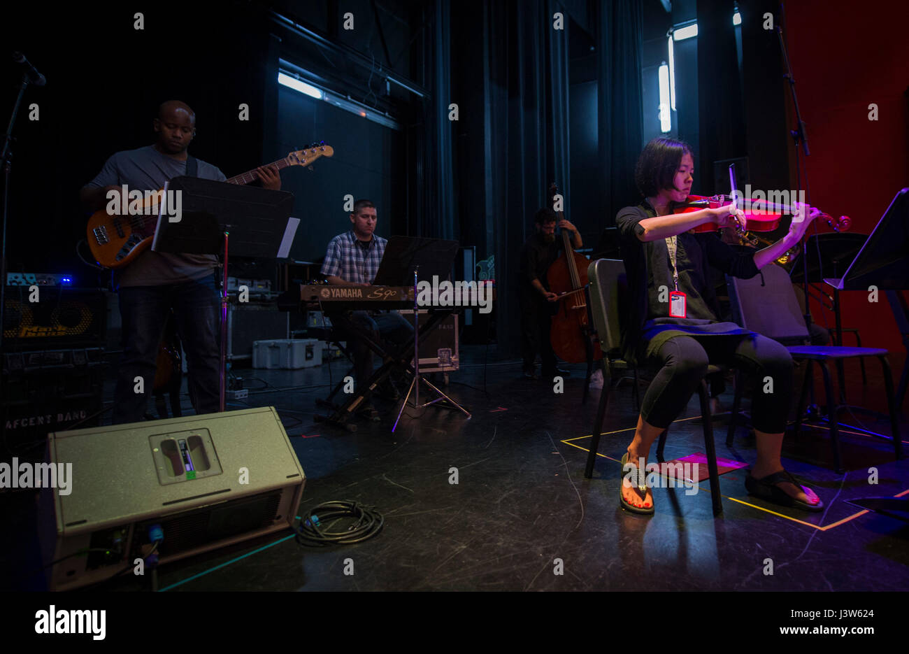 U.S. Air Forces Central Command Band members conduct a rehearsal with ...
