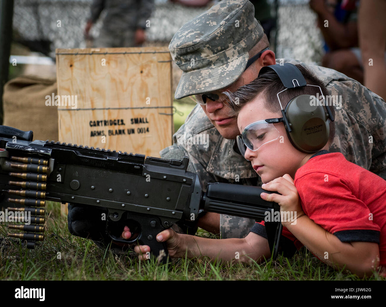 A Soldier talks with a “future Ranger” about a machine gun during the ...