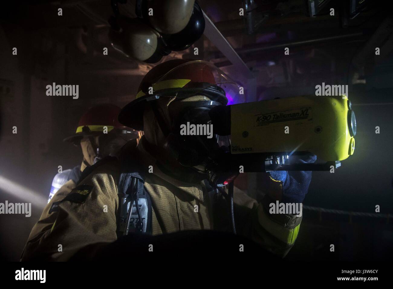 A Damage Controlman aboard the Arleigh Burke-class guided-missile ...