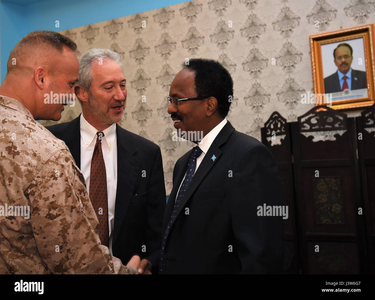 The U.S. Ambassador to Somalia Stephen Schwartz, center, introduces ...