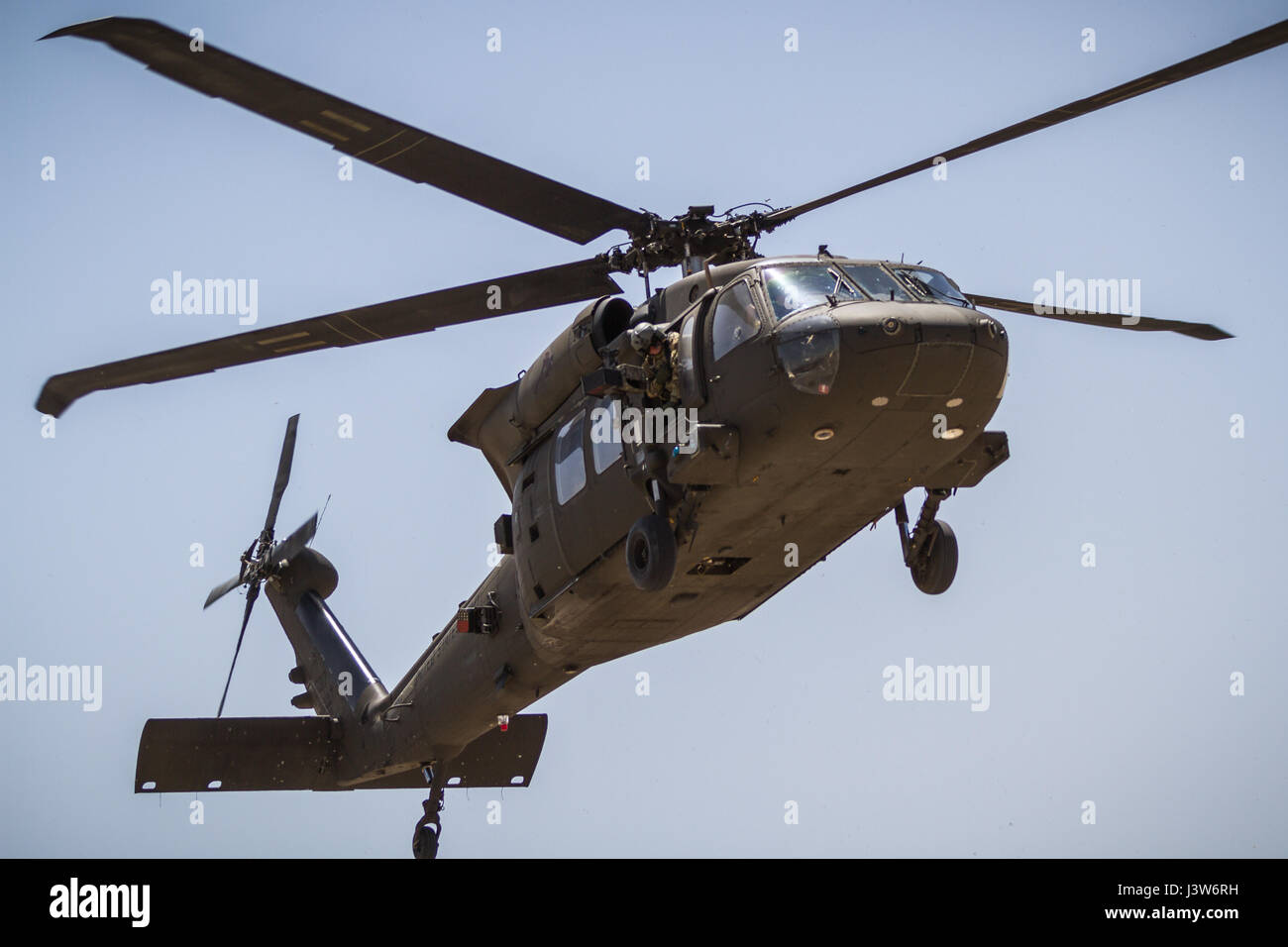 A U.S. Army UH-60 Black Hawk helicopter crew chief assigned to Task ...