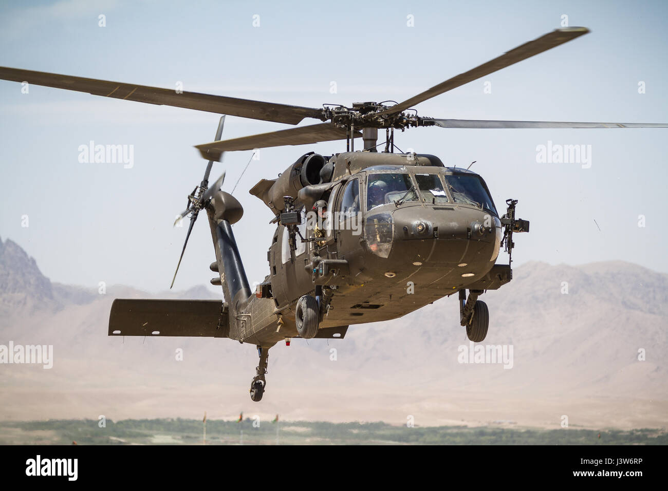 A U.S. Army UH-60 Black Hawk helicopter crew chief assigned to Task ...