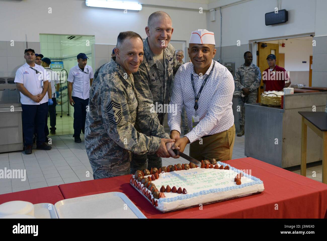 U.S. Air Force Command Chief Master Sgt. Thomas Cooper (left), Col ...