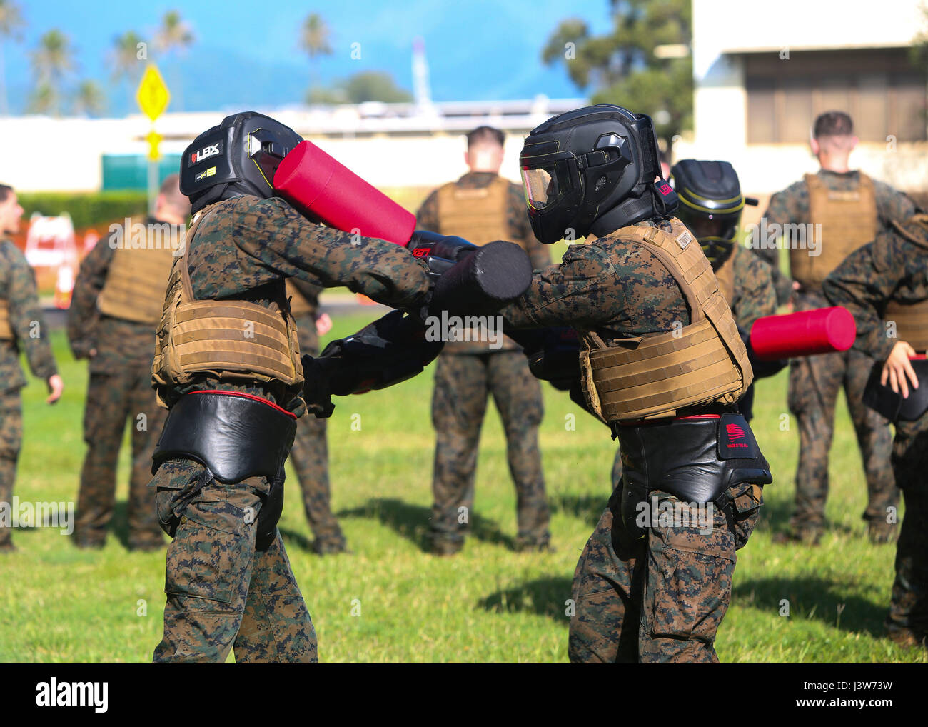 MARINE CORPS BASE HAWAII - Marines attached to the 11th Marine Expeditionary Unit fight during ...