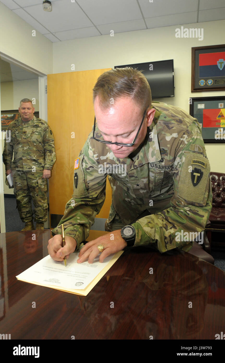Brig. Gen. Lee Henry signs his Assumption of Command for the 36th ...