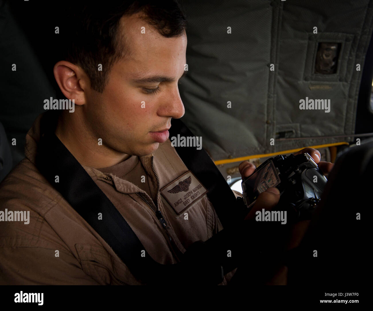 U.S. Naval Aircrewman (Operator) 3rd Class Joey Maringo, assigned to ...