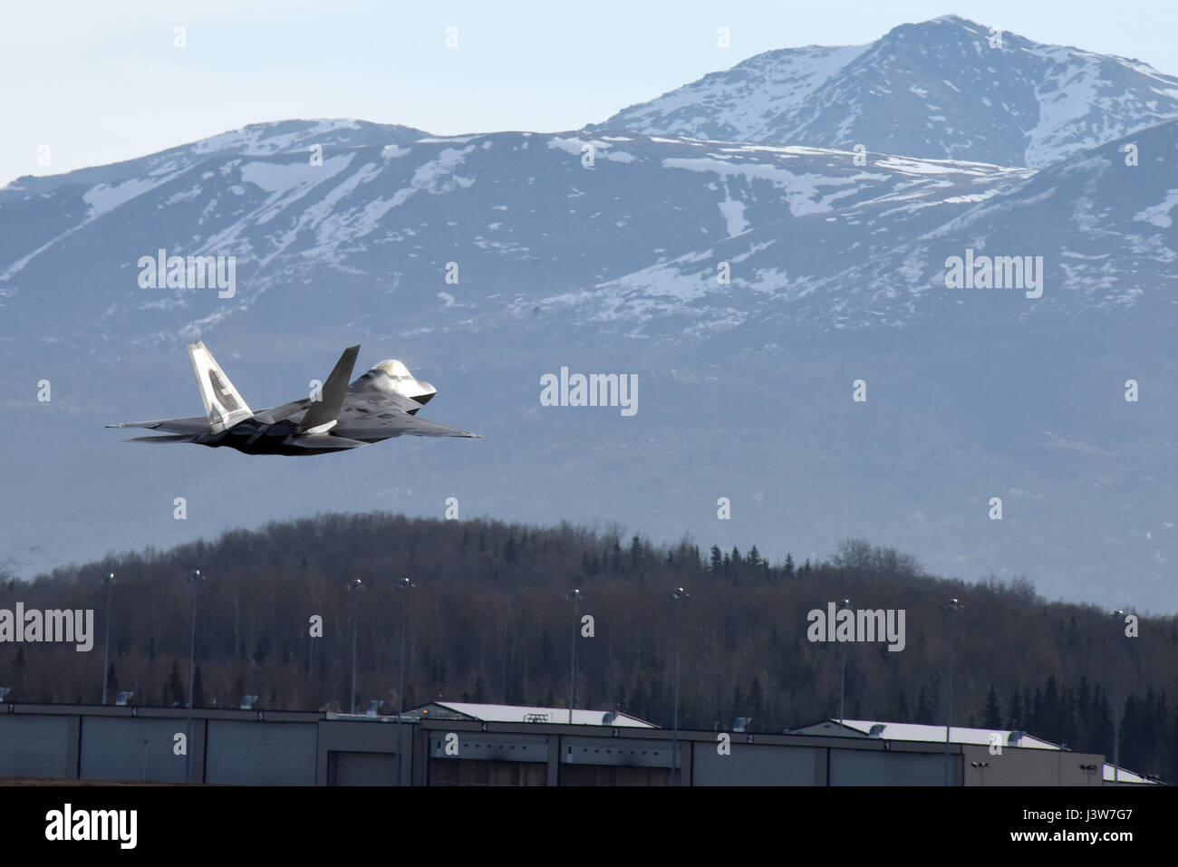 An F-22 Raptor from Joint Base Elmendorf-Richardson, Alaska, departs ...
