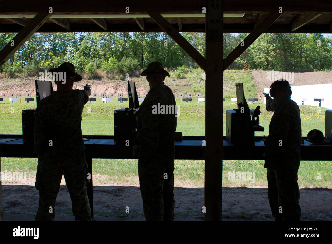Marines fire down the pistol range during the Marine Corps Shooting ...