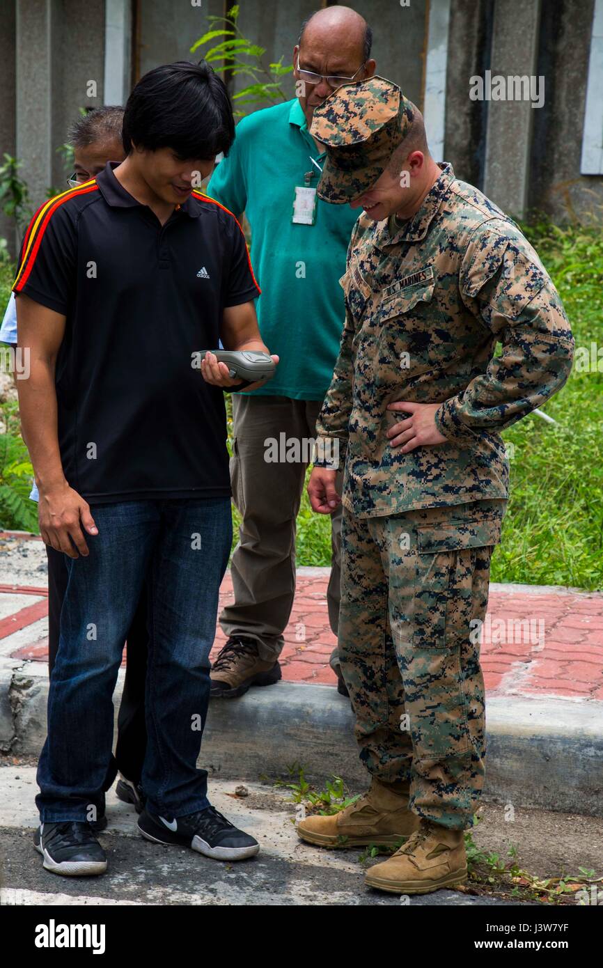 Brian Duenas and U.S. Marine Cpl. Payton Imrie review their plan to ...