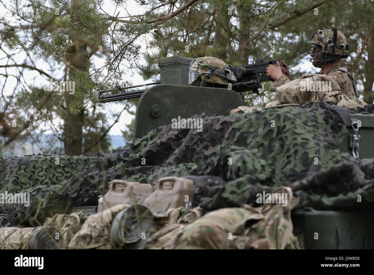 U.S. Soldiers of 2d Cavalry Regiment provide security from a Stryker ...