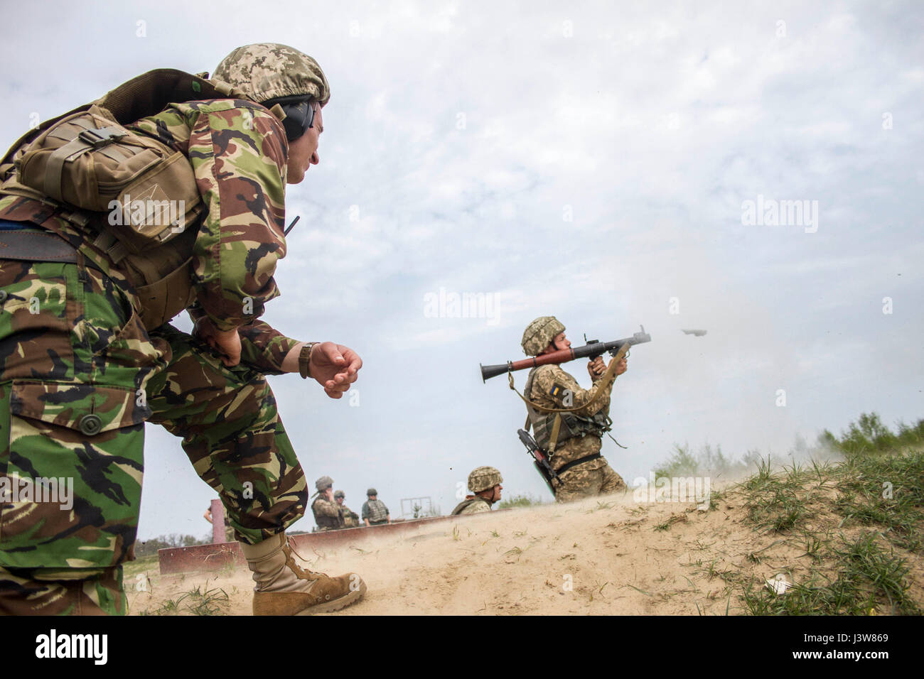 A Yavoriv Combat Training Center trainer observes and coaches Ukrainian ...