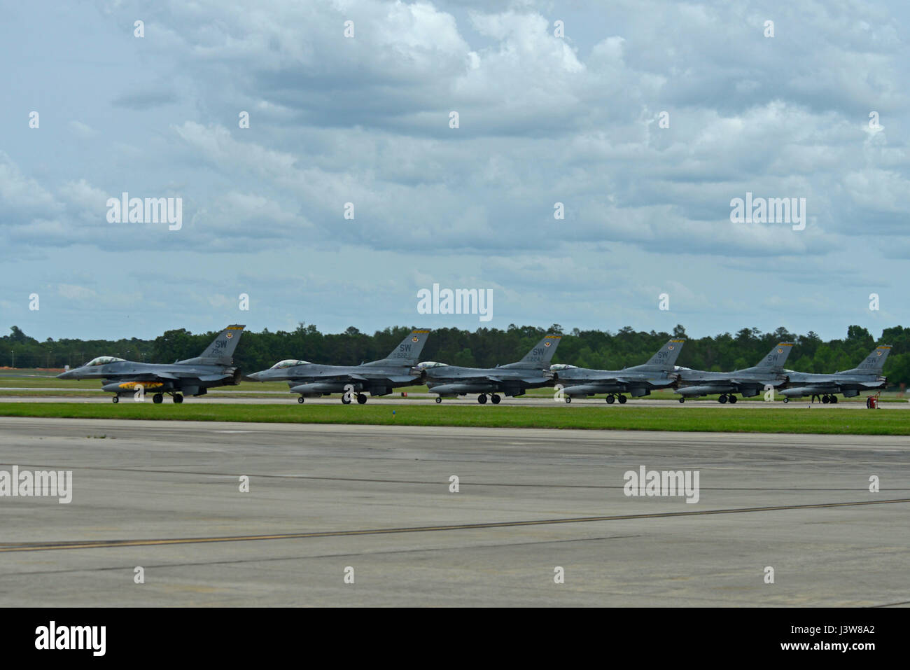 Pilots assigned to the 79th Fighter Squadron (FS) wait to taxi their F ...