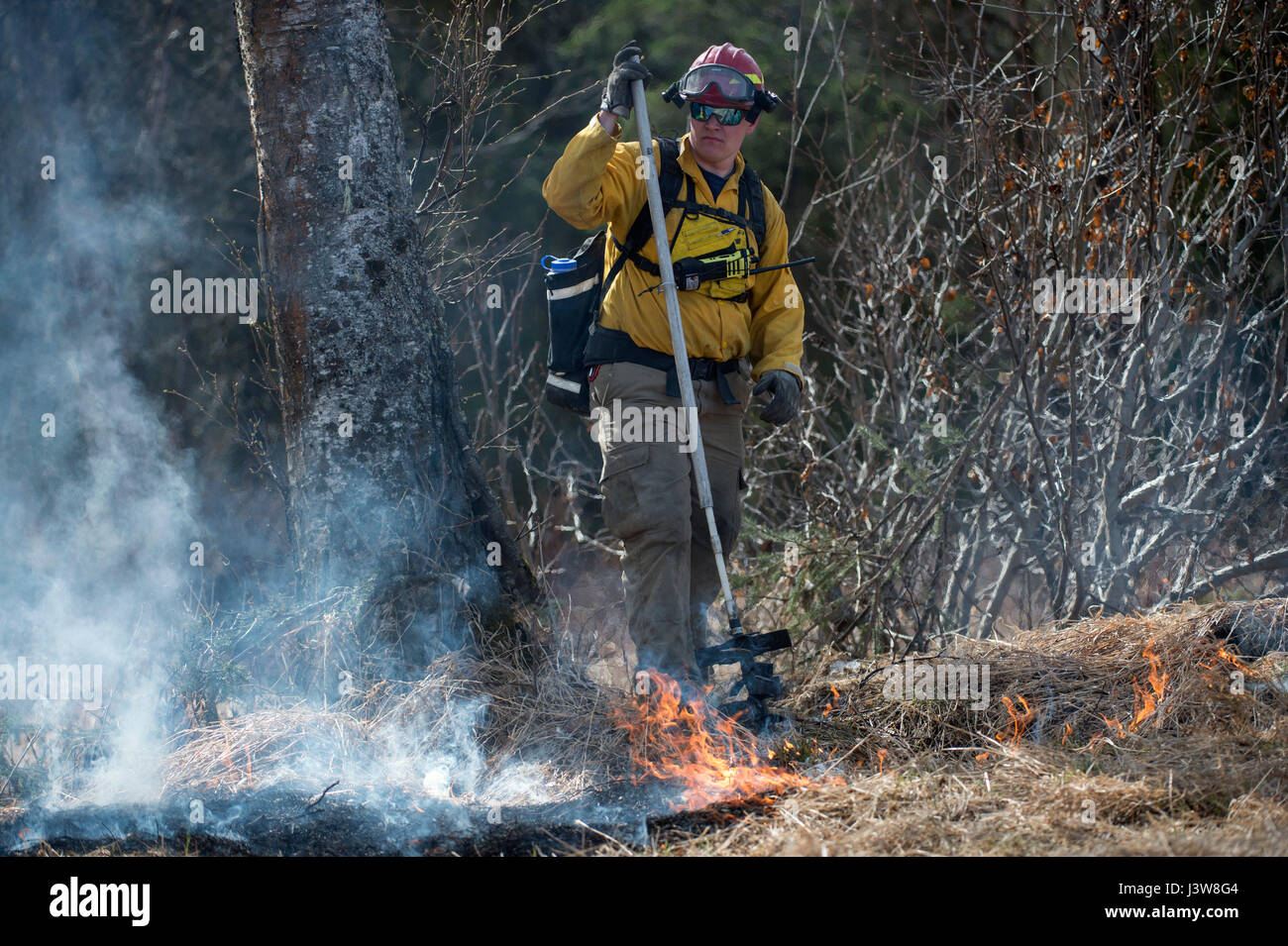 Stephen Spealman, a firefighter assigned to the 673d Civil Engineer ...