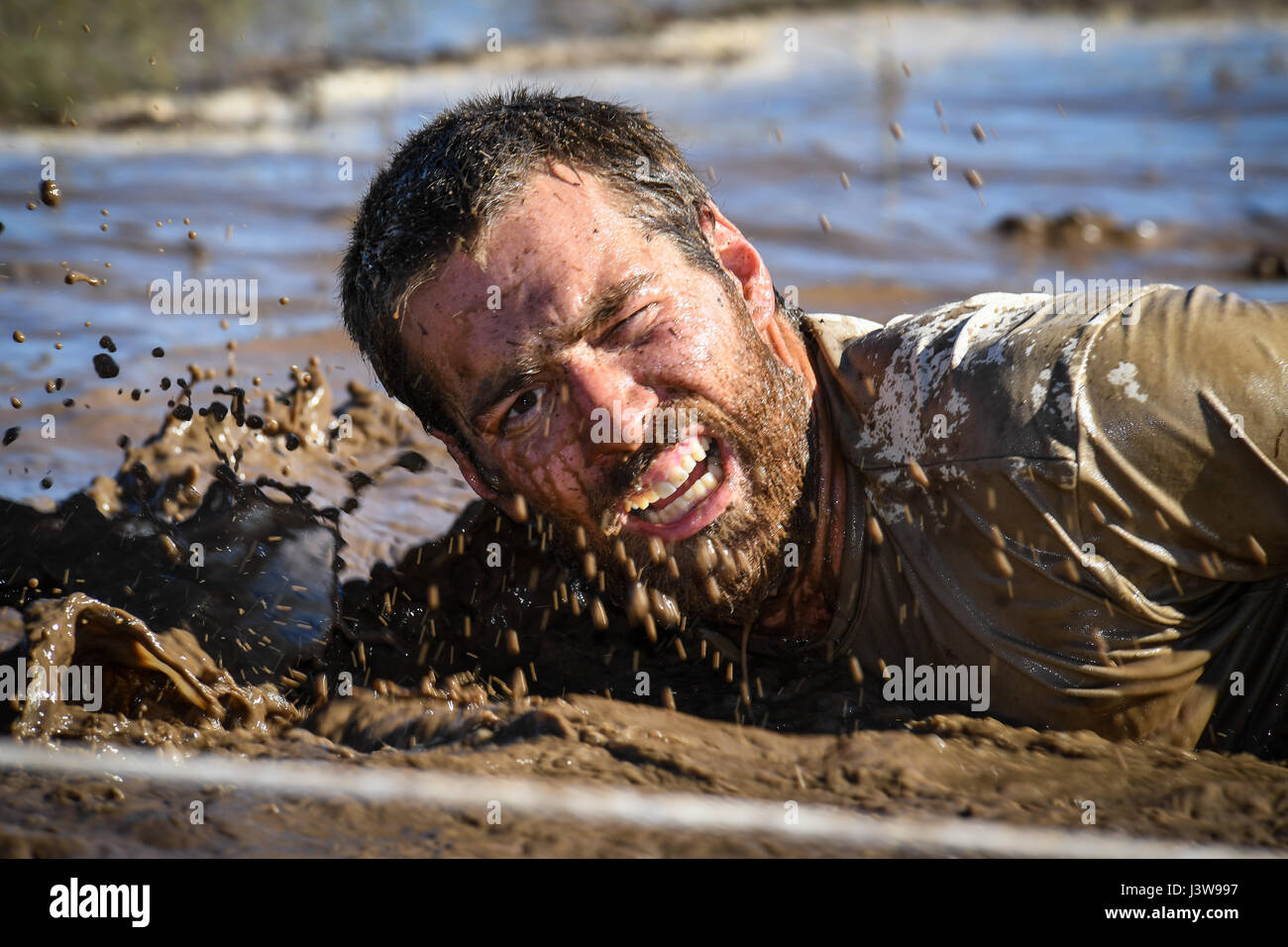Participants navigate obstacles during a mud run at Hill Air Force Base ...
