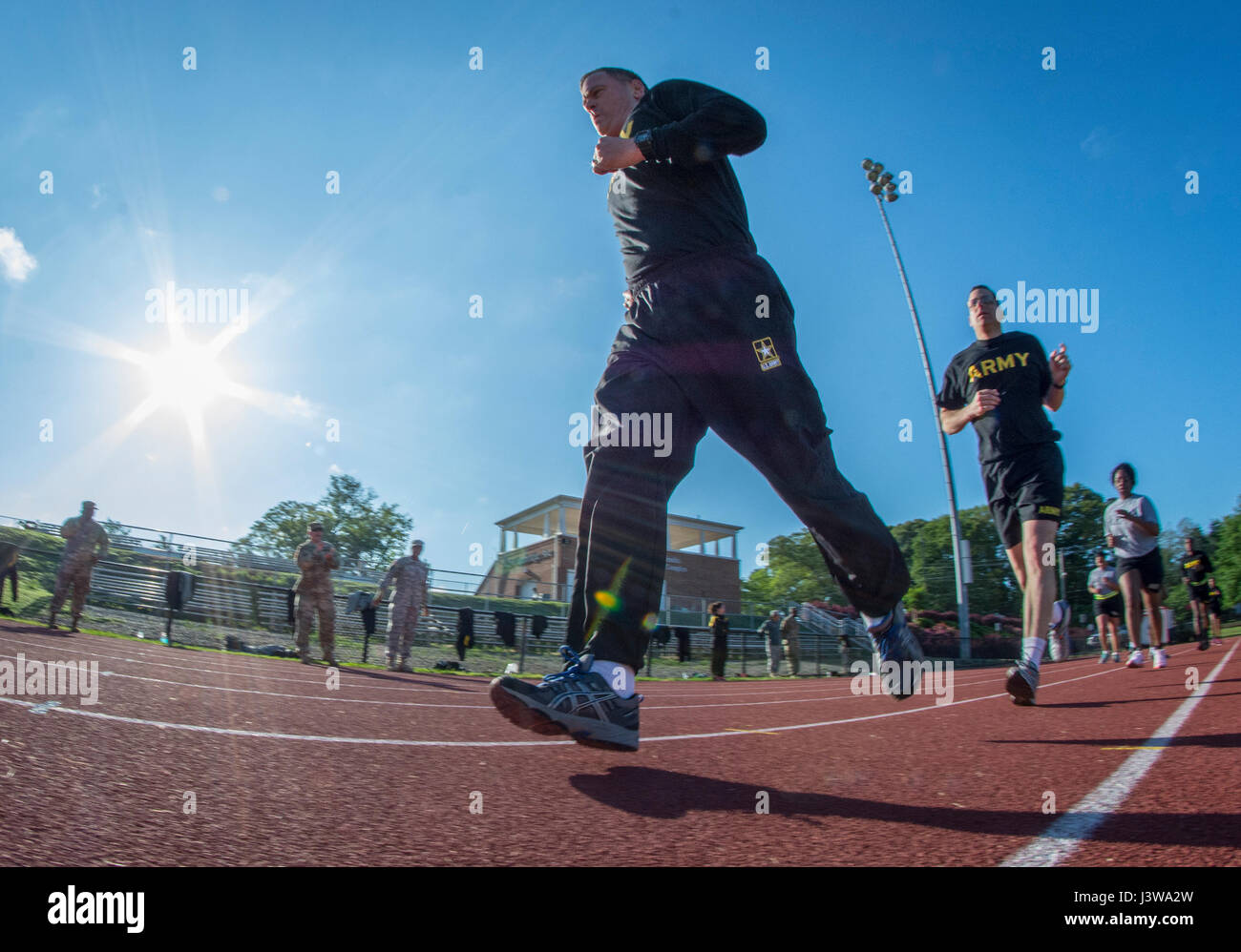 A U.S. Army Reserve soldier completes a two-mile run as part of the ...