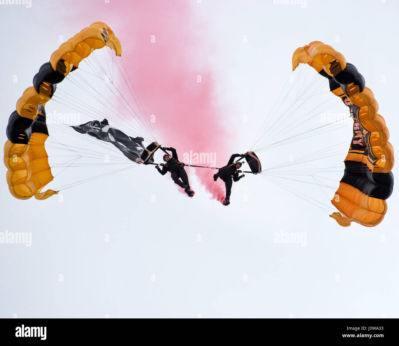 Members of the U.S. Army Golden Knights parachute team perform ...